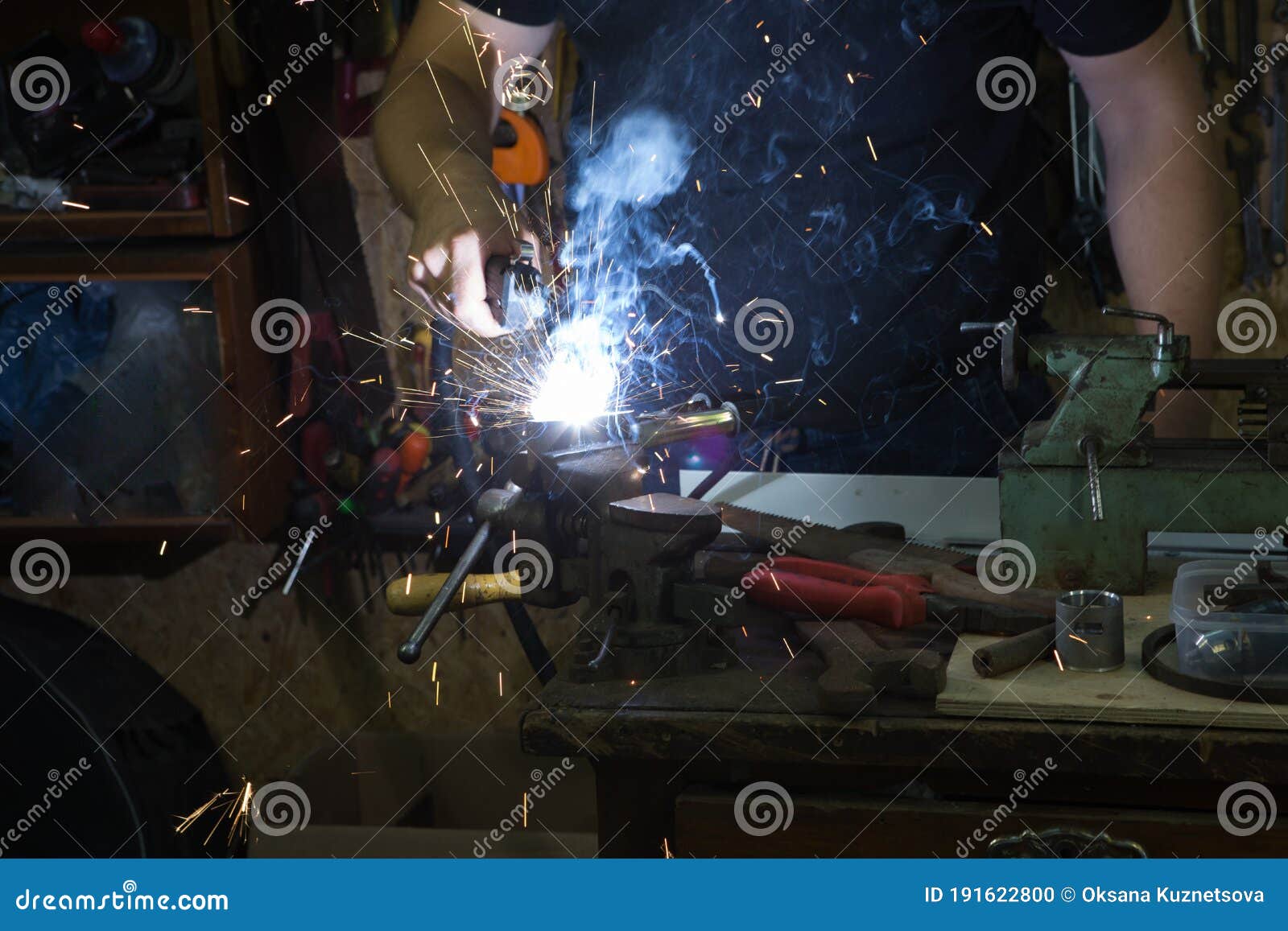 Working with the Tool. Hands of a Young Man Working with a Welding ...