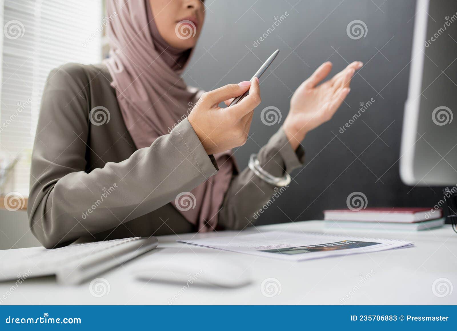 Hands of Young Teacher in Hijab Explaining Something in Front of ...