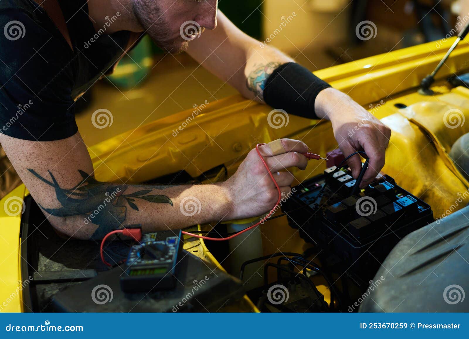 Hands of Young Technician Bending Over Motor of Car and Using ...