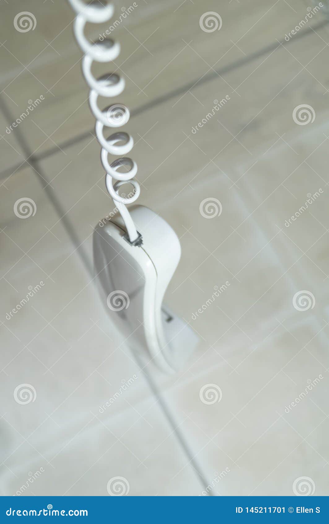 The Handset of the Wired Phone is Hanging on the Wire Stock Image ...