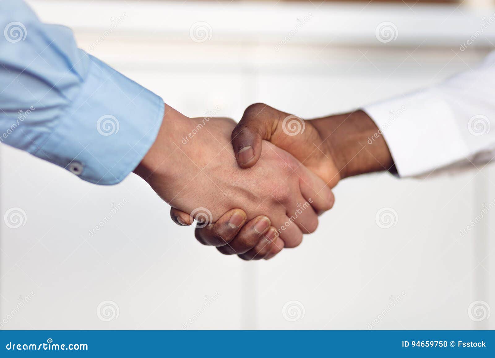 Handshake between African and a Caucasian Man Stock Photo - Image of ...