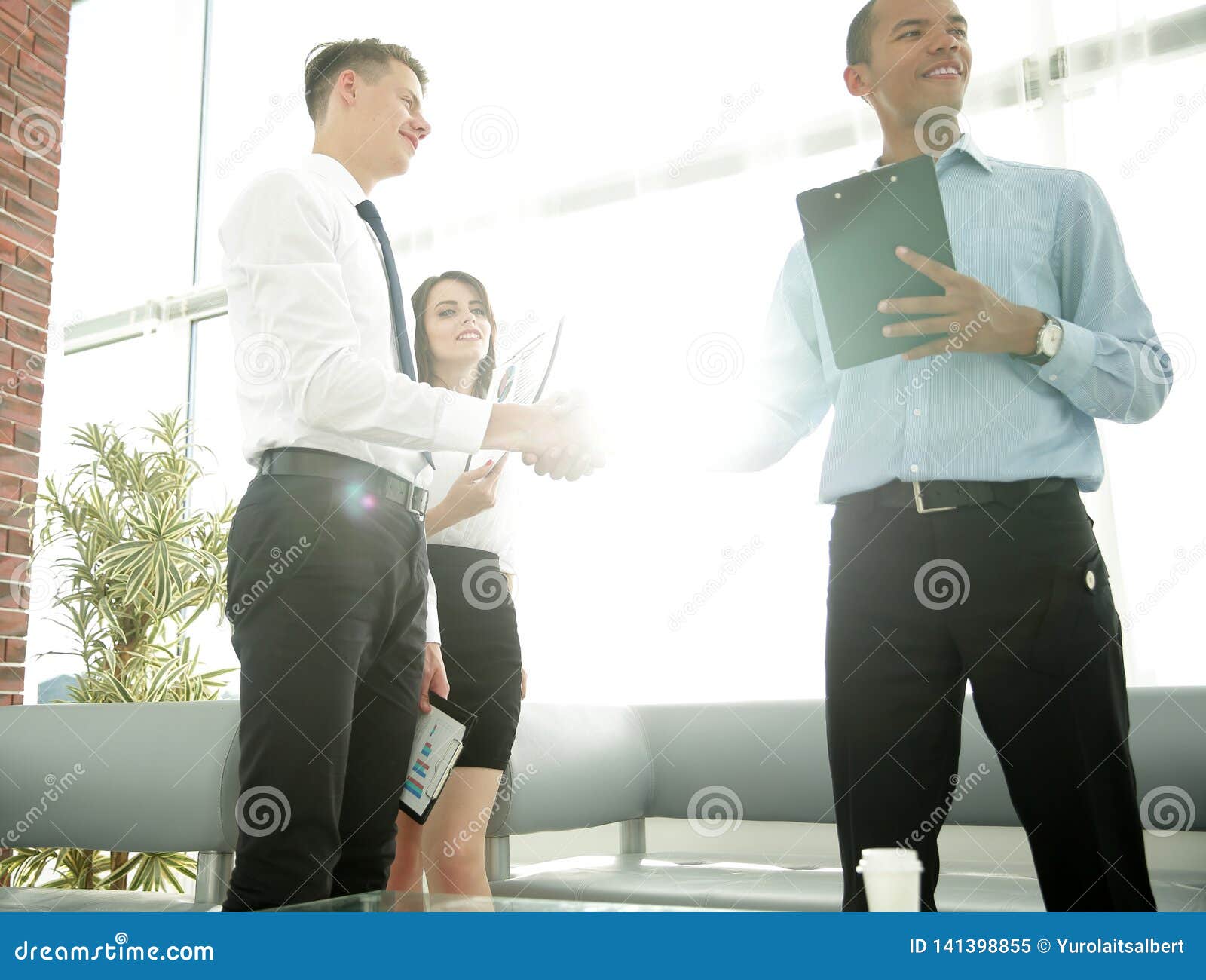 Handshake of Business Partners Standing in the Office Stock Image ...