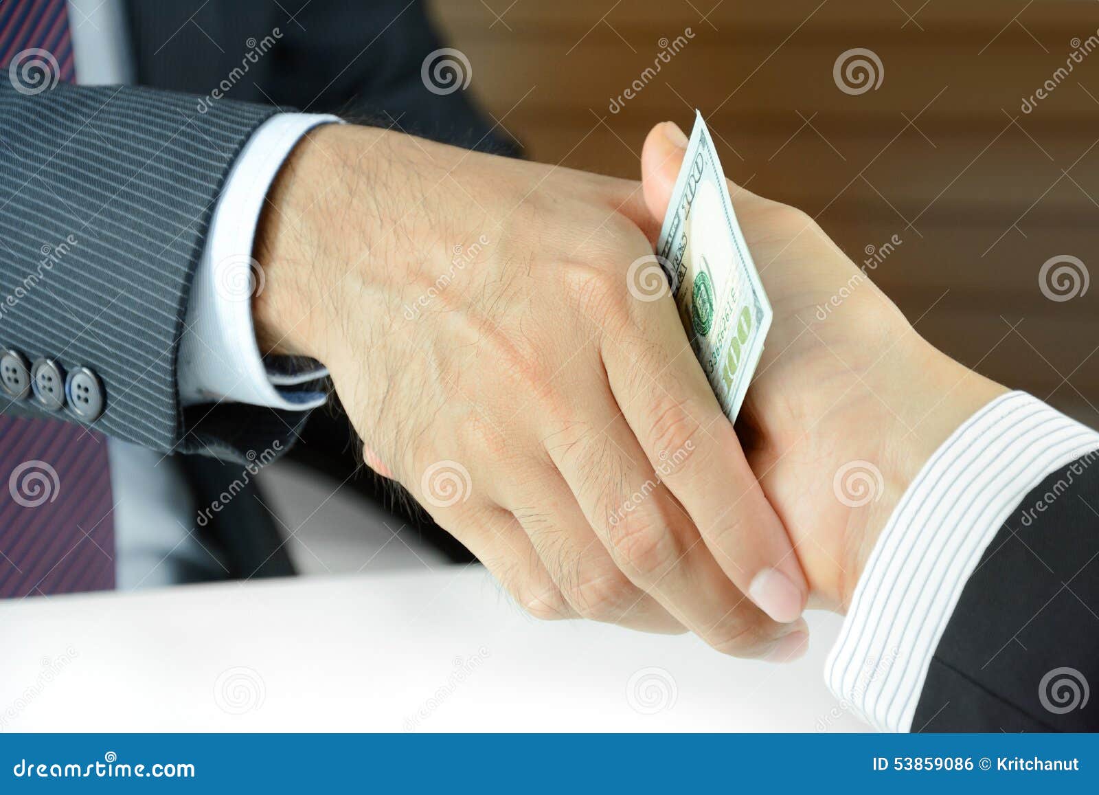 Handshake of Businessmen with Money - Bribery Concept Stock Photo ...