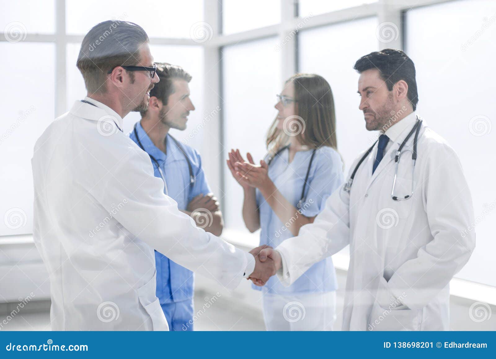 Handshake Colleagues in the Hospital Corridor Stock Image - Image of ...