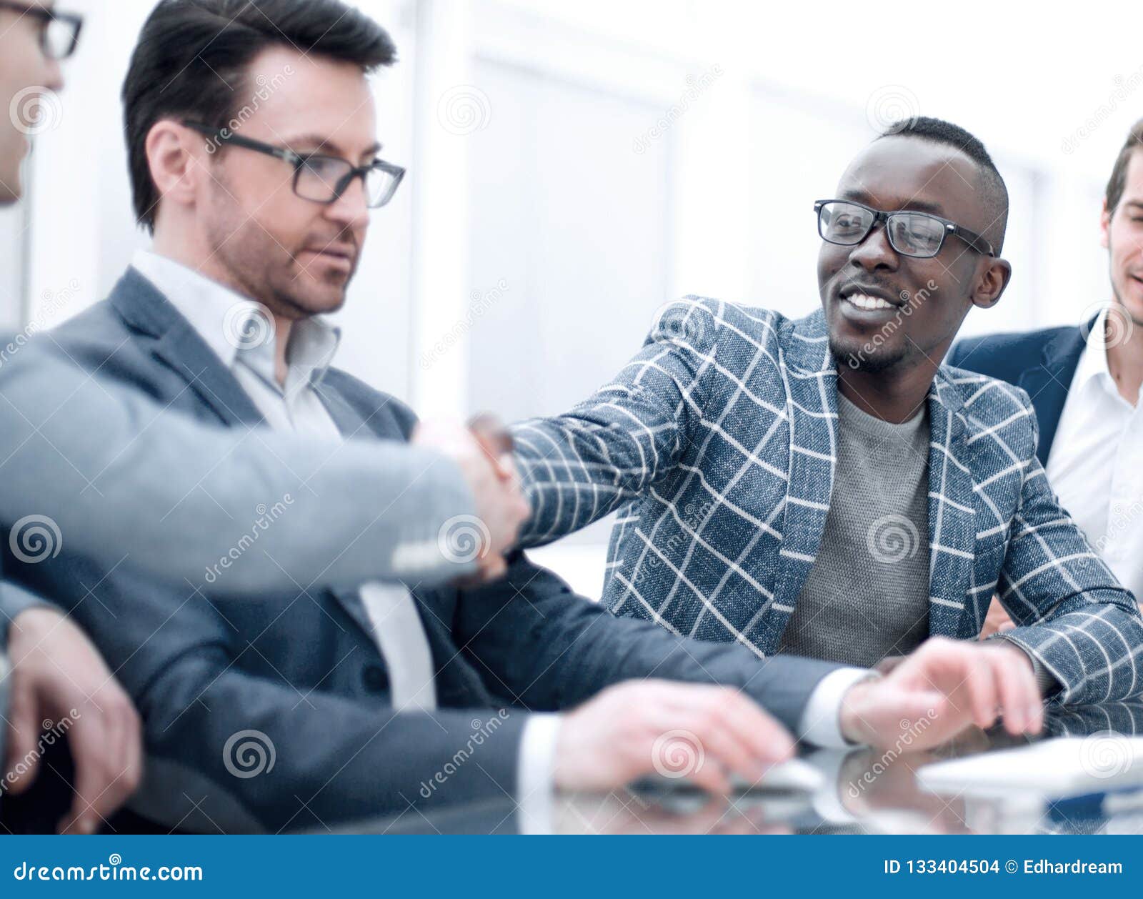 Handshake Colleagues Sitting at the Desk Stock Photo - Image of ...