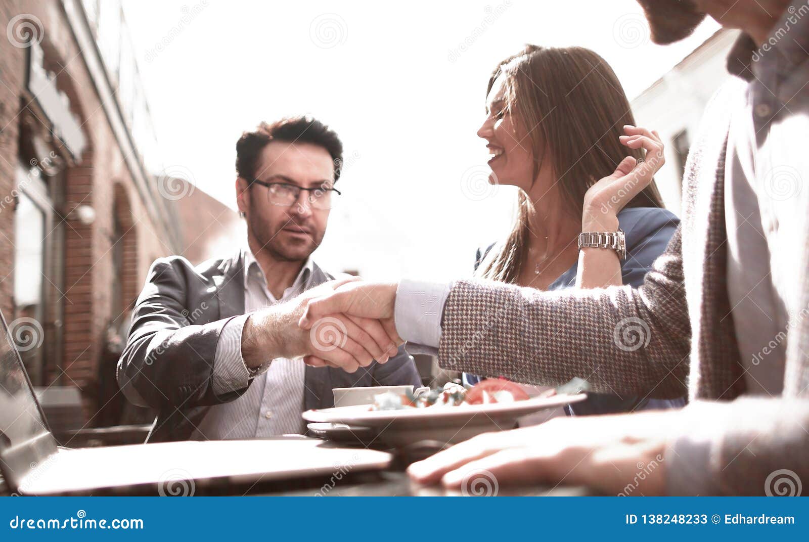 Handshake Colleagues at a Table in a Street Cafe Stock Image - Image of ...