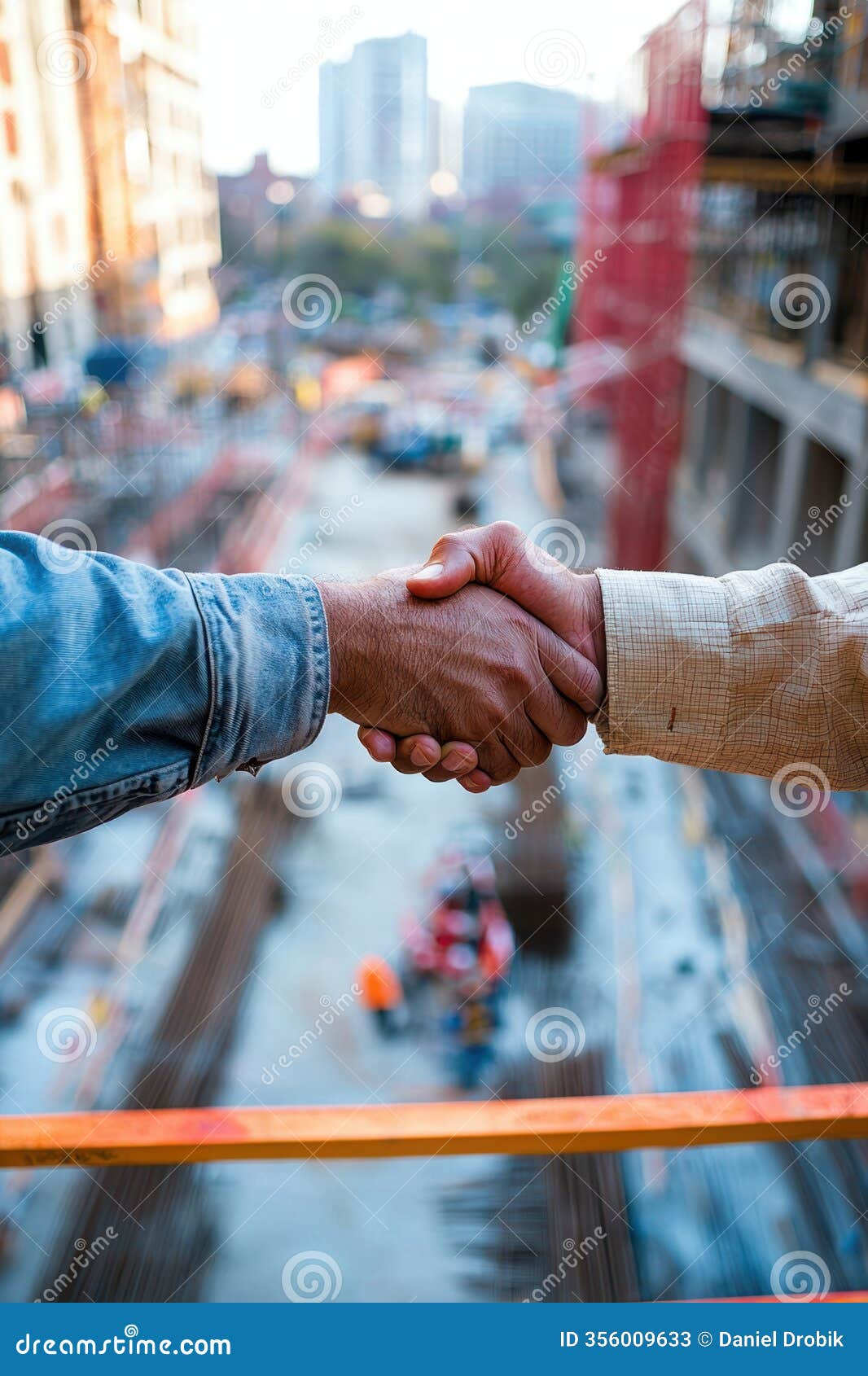 A Handshake on a Construction Site Symbolizing the Strength of Building ...
