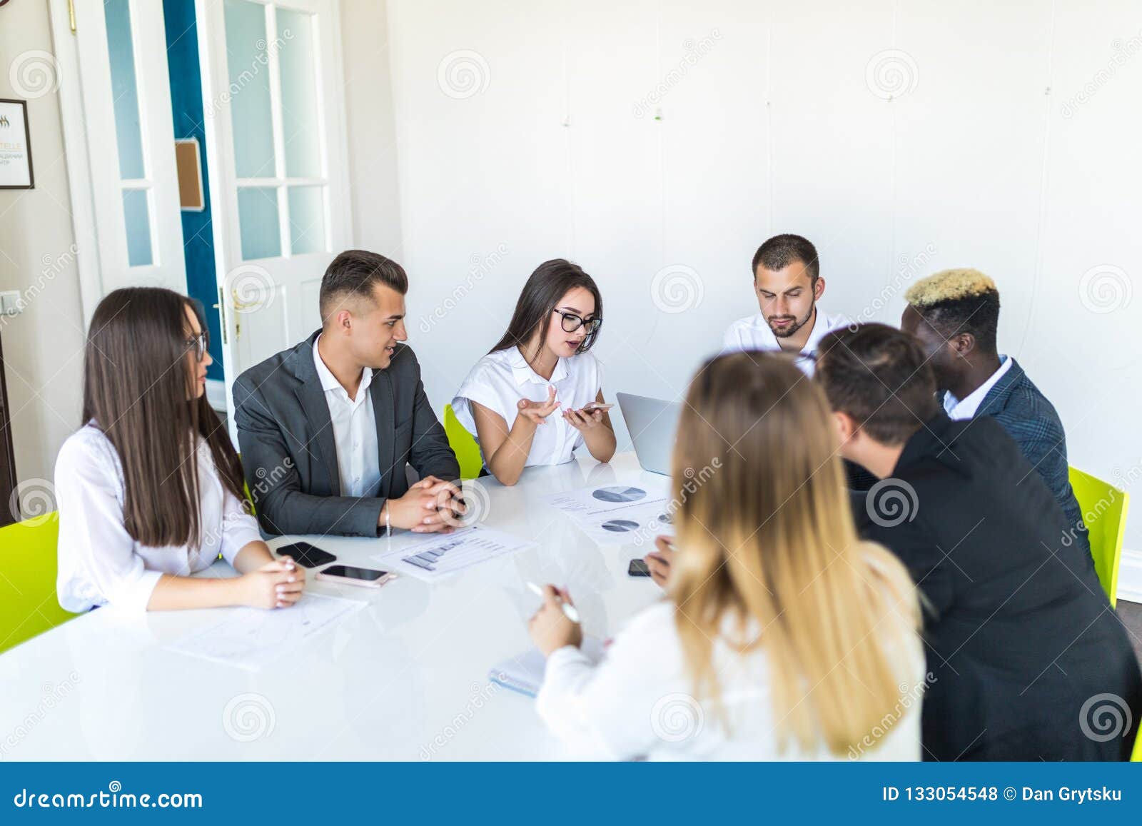 Handshake in Diversity Business Team Meeting, Documents and Graphs on ...