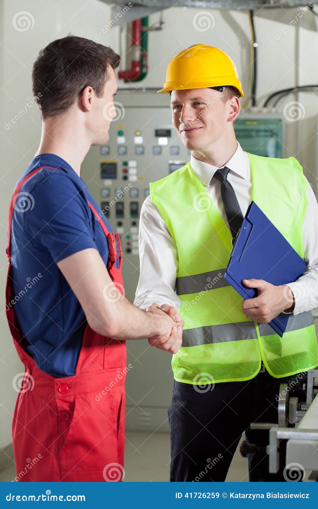 Handshake in a factory stock image. Image of caucasian - 41726259