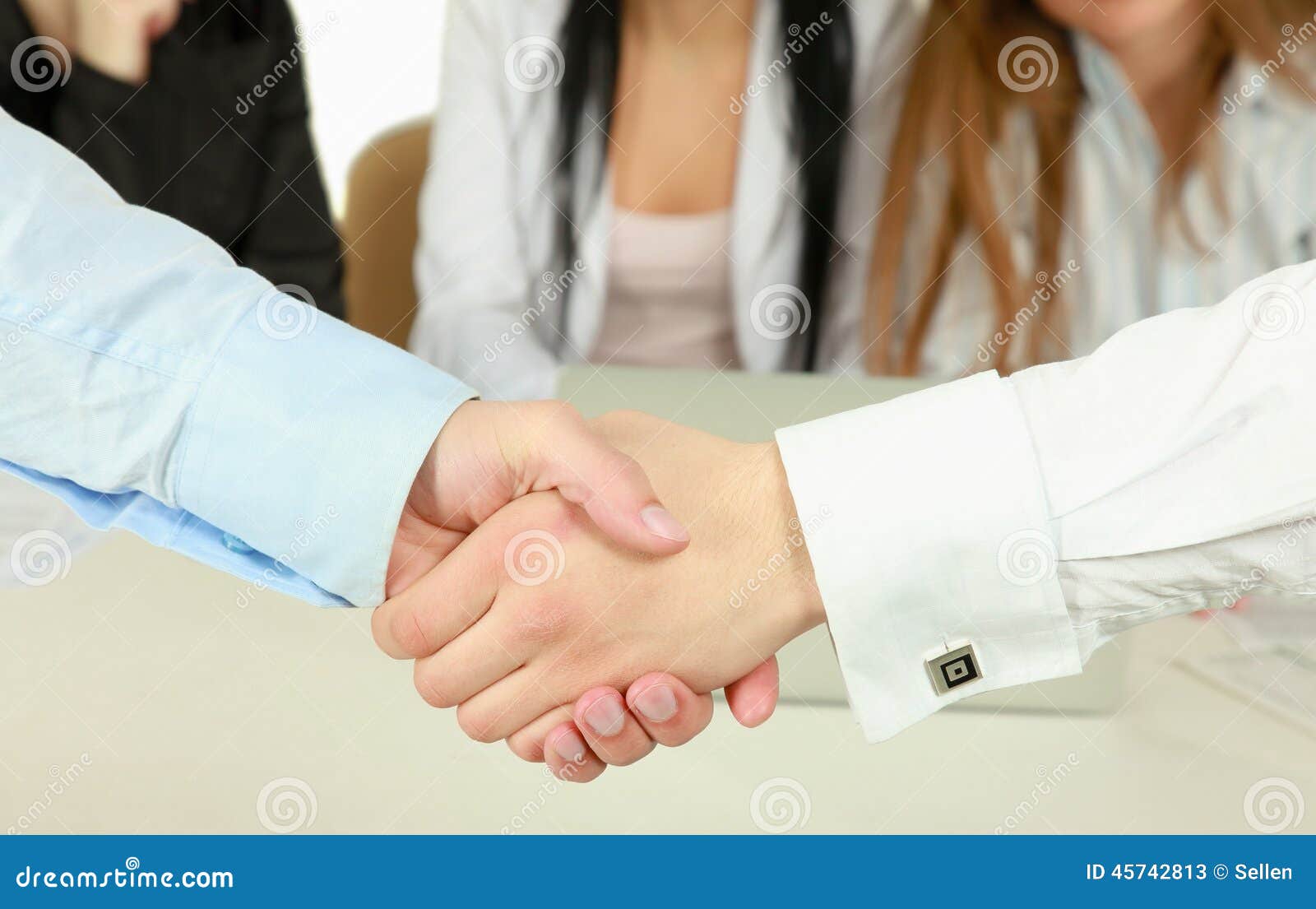 Handshake in Front of Business People. Stock Image - Image of ...