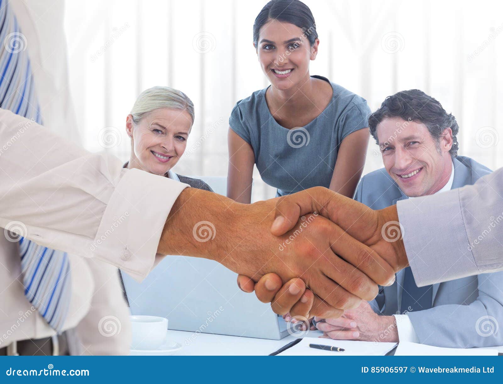 Handshake in Front of Business People in Office Stock Image - Image of ...