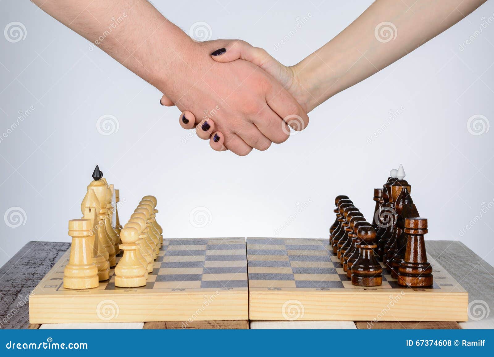 Handshake in Front a Game of Chess Stock Photo - Image of communication ...