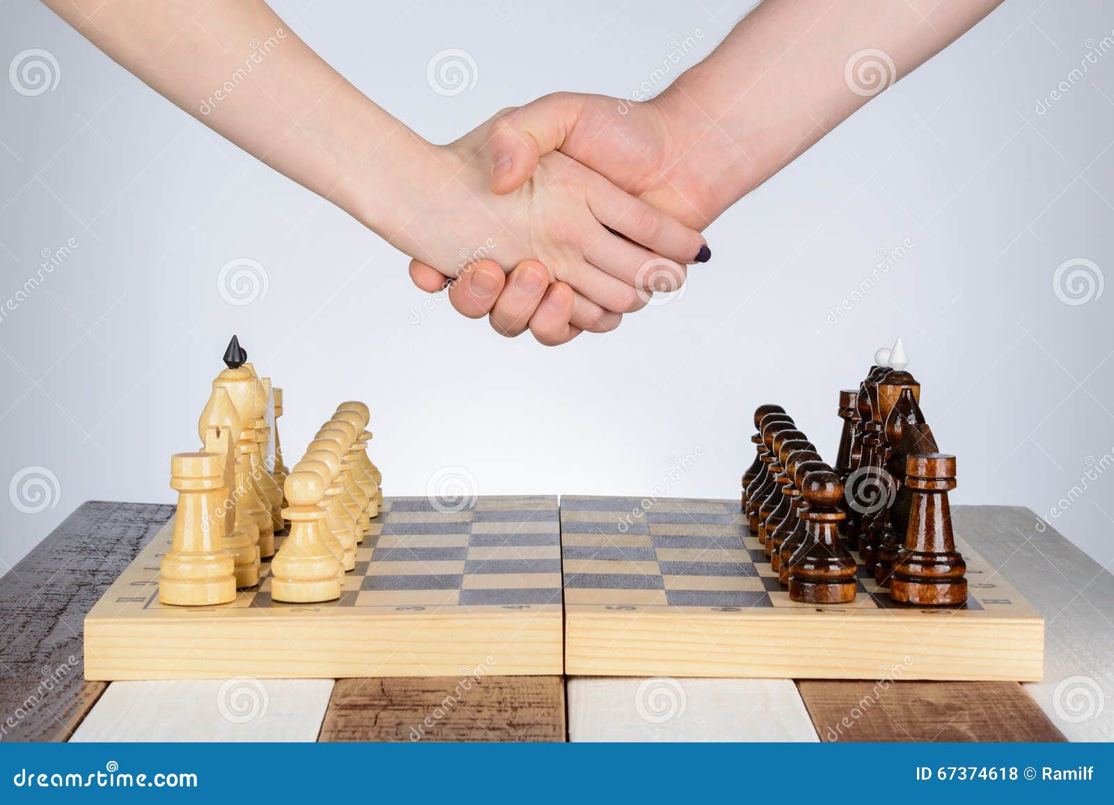 Handshake in Front a Game of Chess Stock Photo - Image of business ...