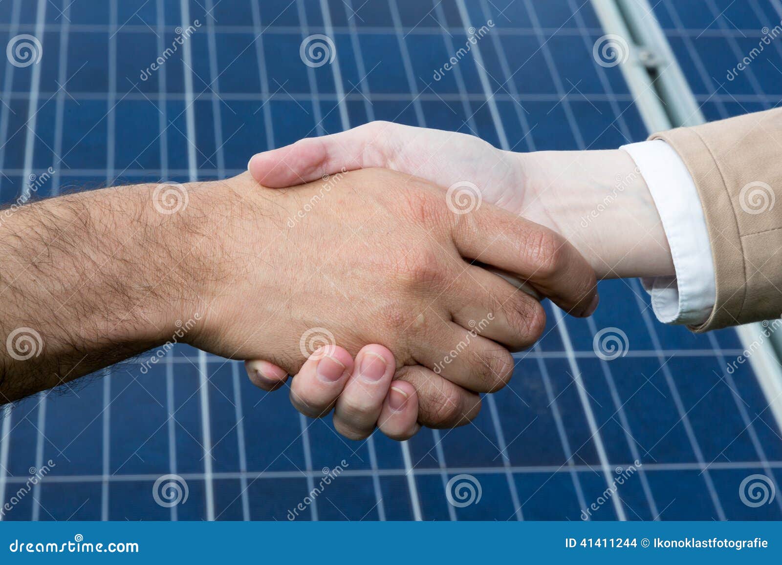 A Handshake in Front of Solar Energy Panels Stock Photo - Image of ...