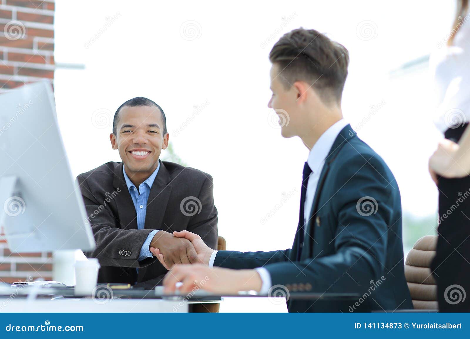 Handshake International Business Partners on a Desk Stock Image - Image ...