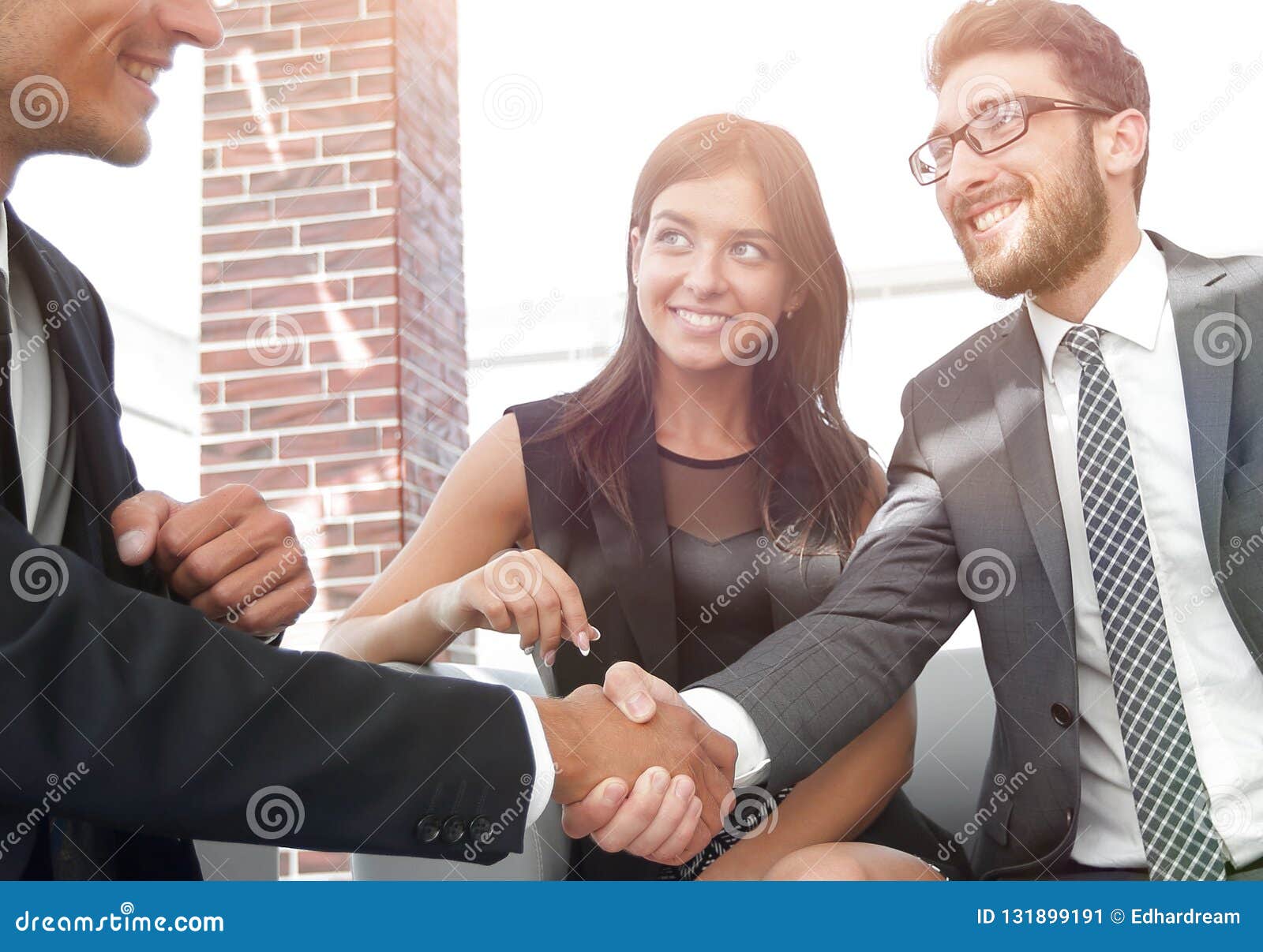 Handshake Manager and the Client at a Meeting in the Office Lobby ...