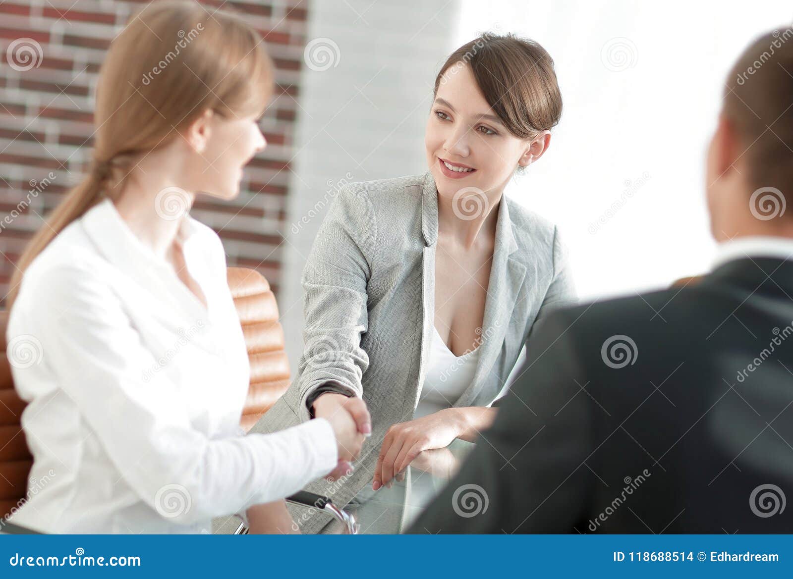 Handshake of a Manager, and a Client Sitting Behind a Desk Stock Photo ...