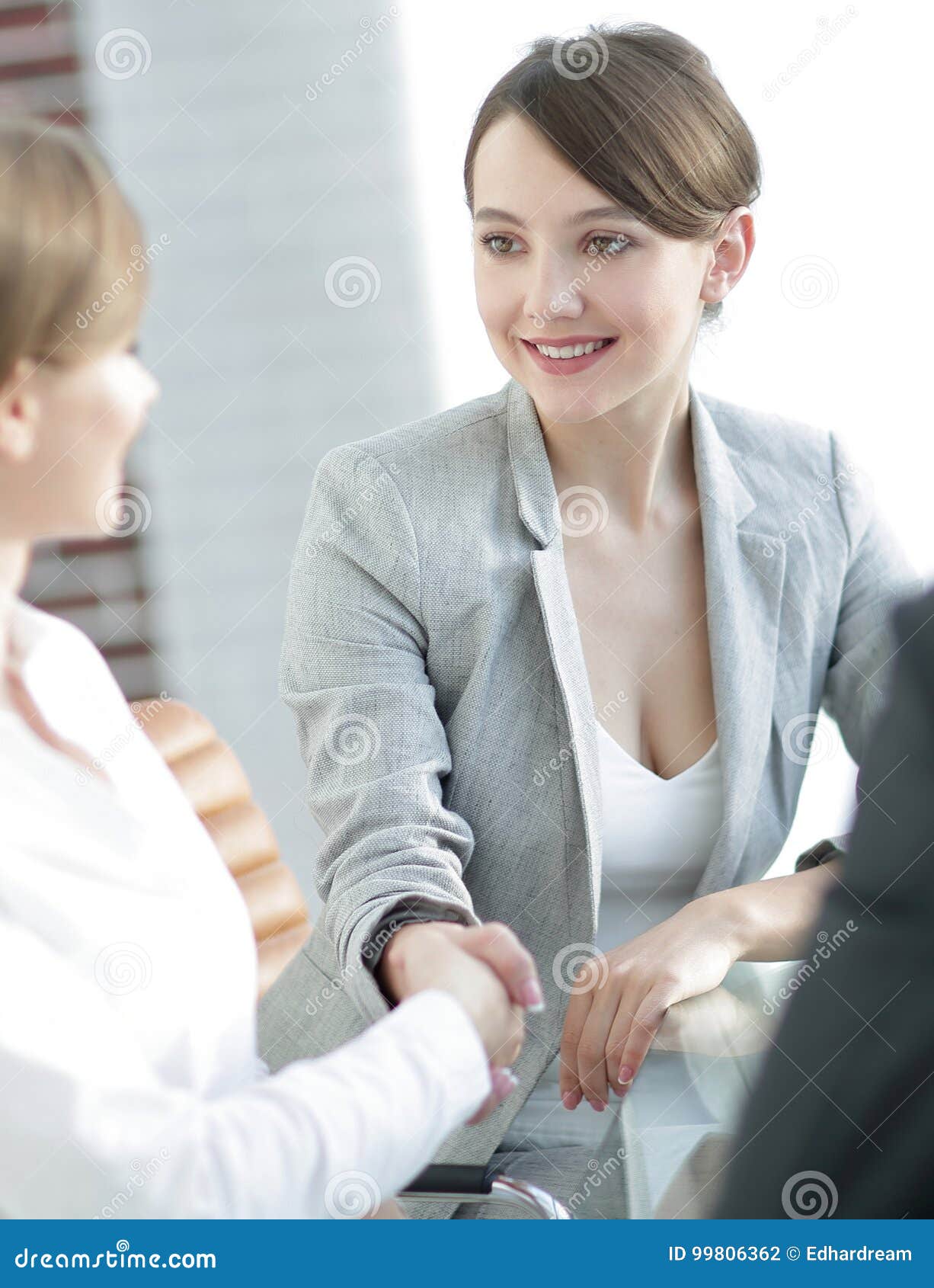 Handshake of a Manager, and a Client Sitting Behind a Desk Stock Photo ...