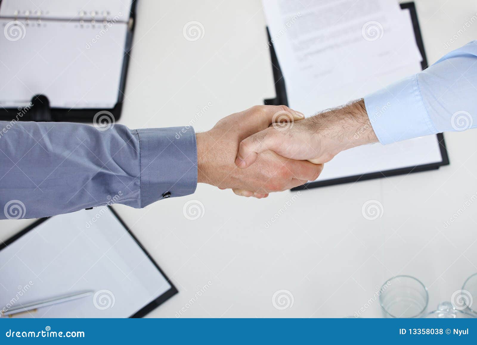 Handshake Over Meeting Table Stock Photo - Image of closeup, group ...