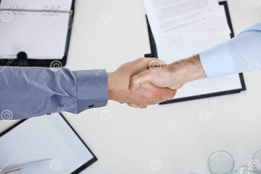 Handshake Over Meeting Table Stock Photo - Image of closeup, group ...