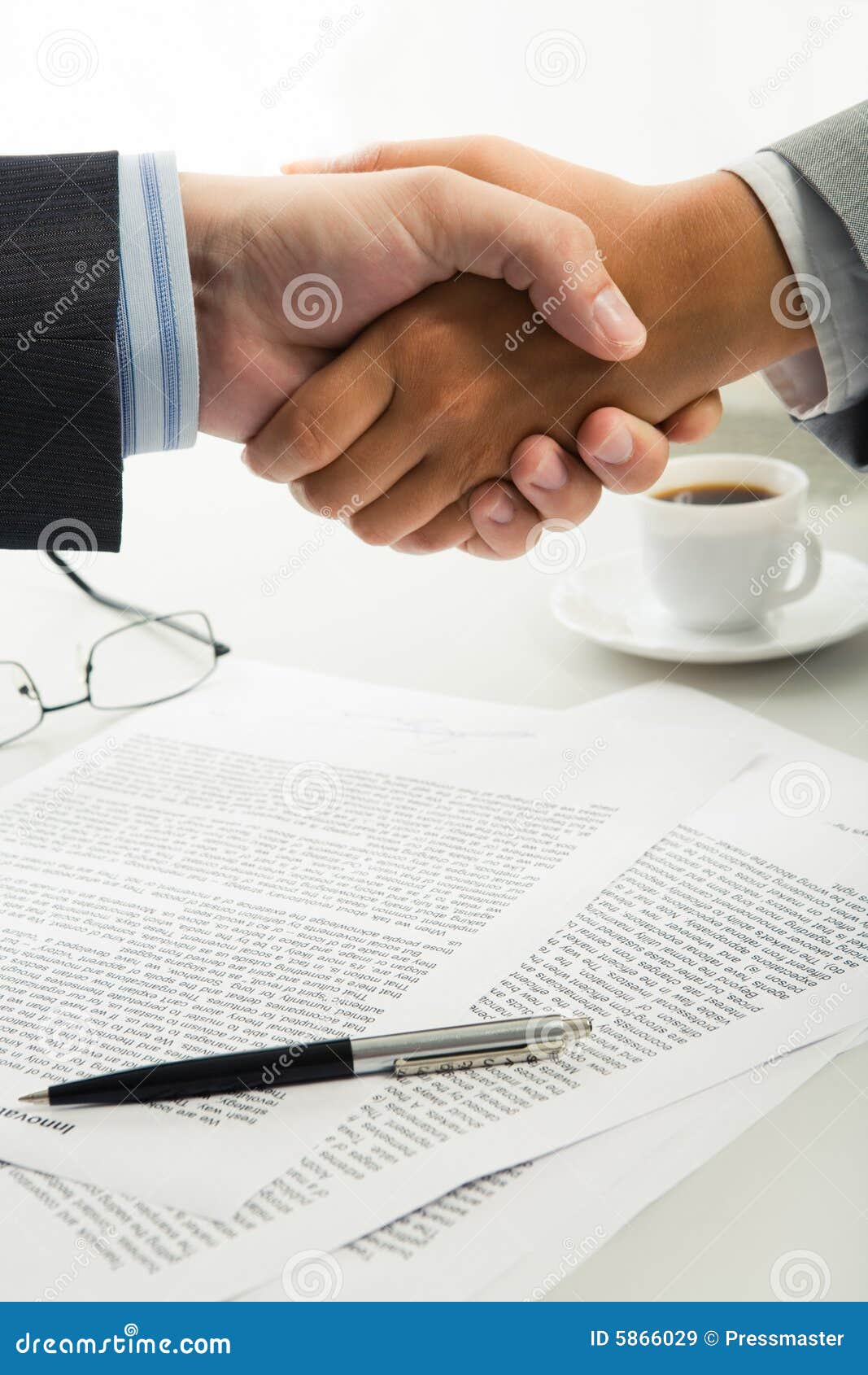 Handshake over workplace stock image. Image of closeup - 5866029