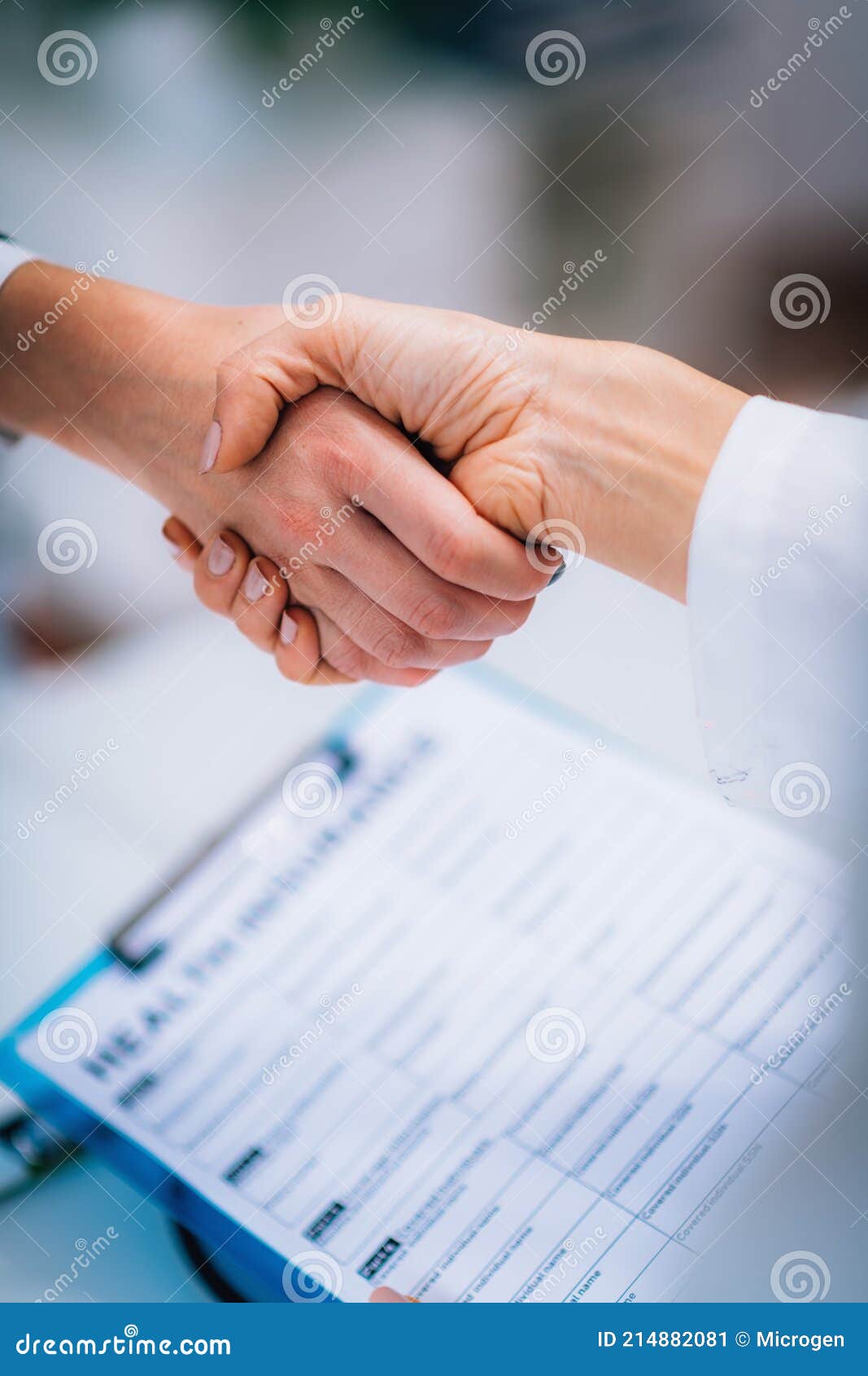 Handshake after Signing Health Insurance Form Stock Image - Image of ...