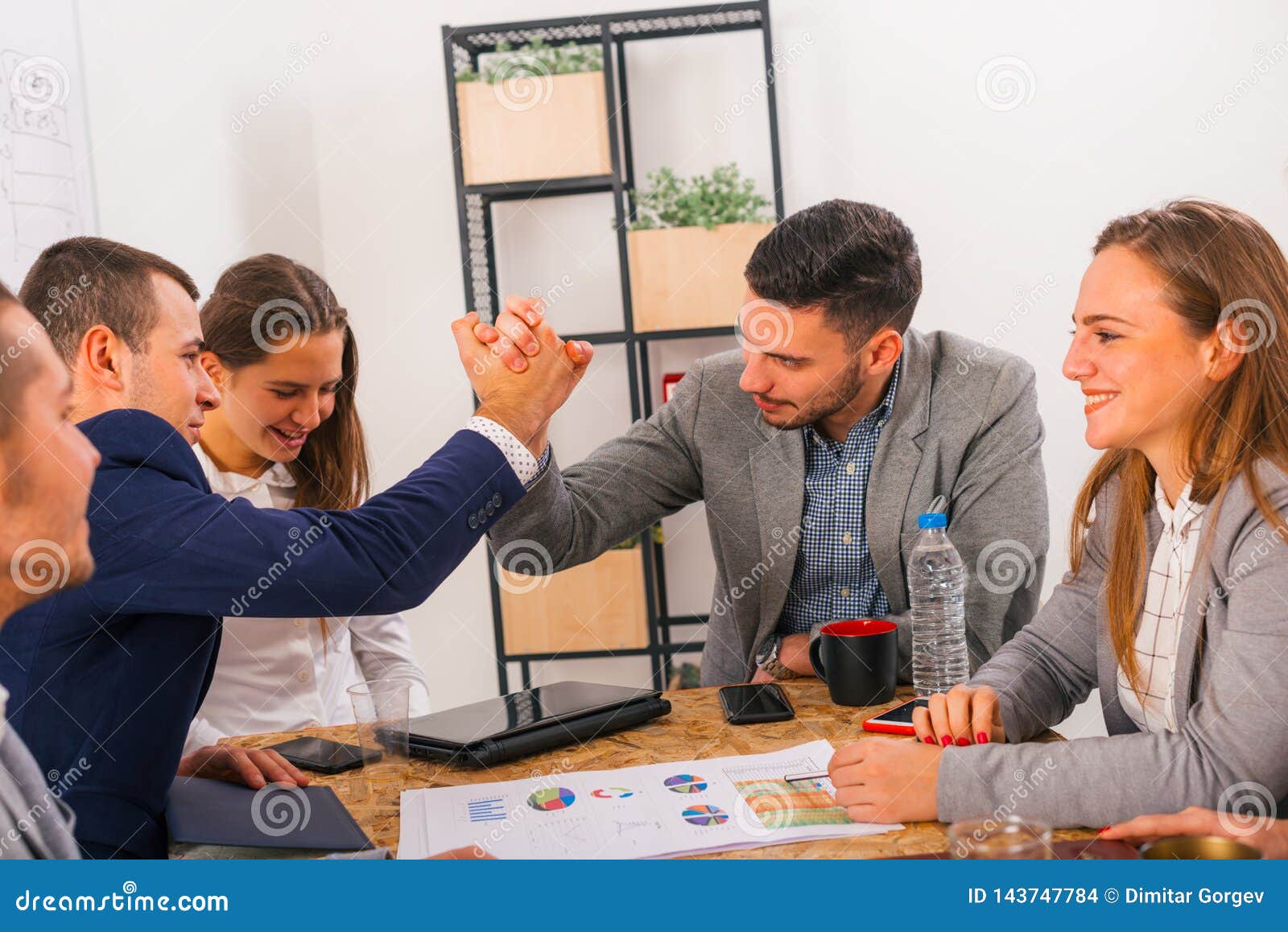 Handshake and Smile at the Business Meeting Table between Business ...
