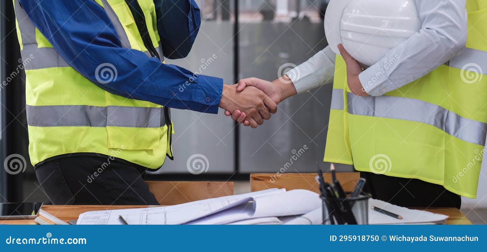 A Handshake between a Team of Engineers Working Together To Plan a ...
