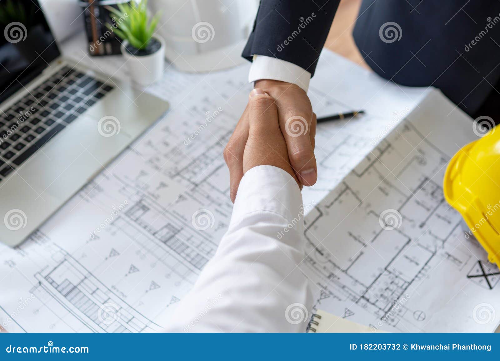 Handshake of Two Business Man, after Architect Working and Planning ...