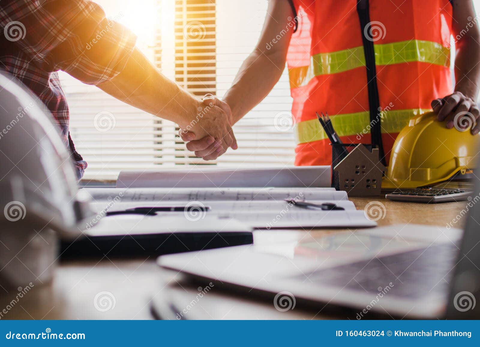 Handshake of Two Business Man, after Architect Working and Planning ...