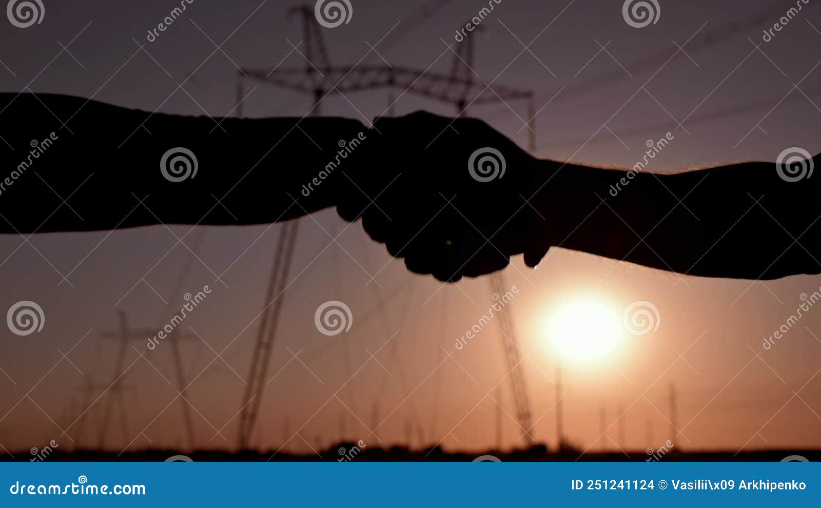 Handshake of Two Electrical Engineers Against the Backdrop of High ...