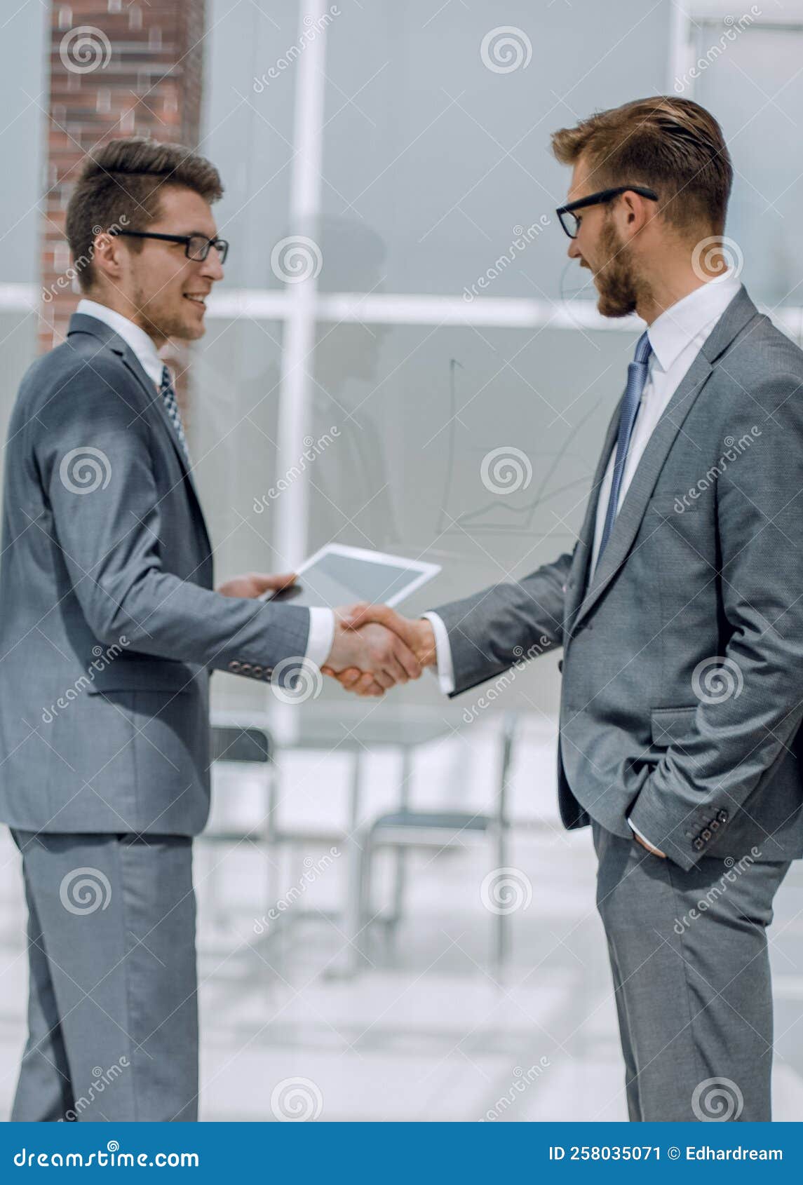 Handshake Two Employees Standing in the Office Stock Image - Image of ...