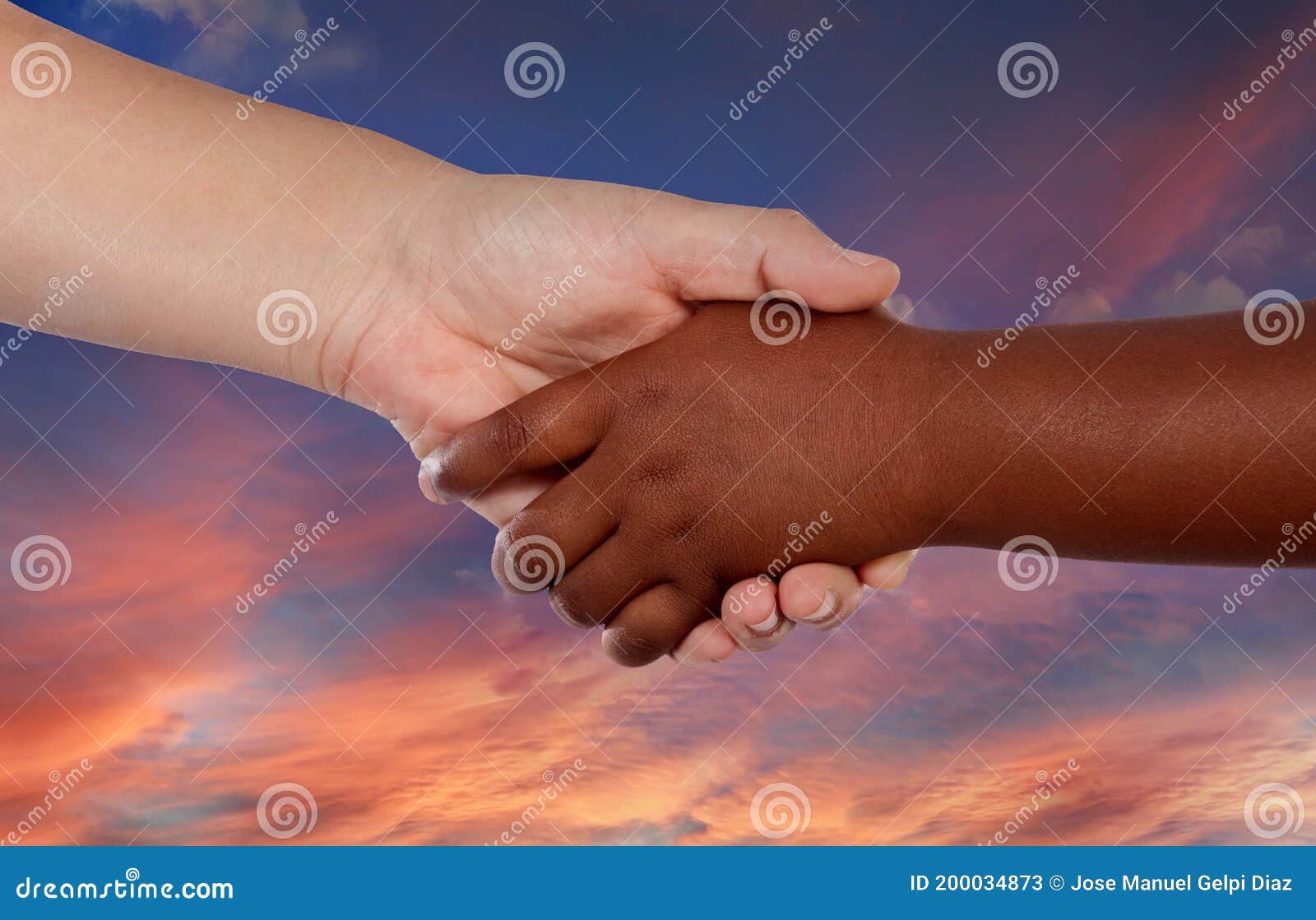 Handshake between Two Hands with Different Colors on a Amazing Sky ...