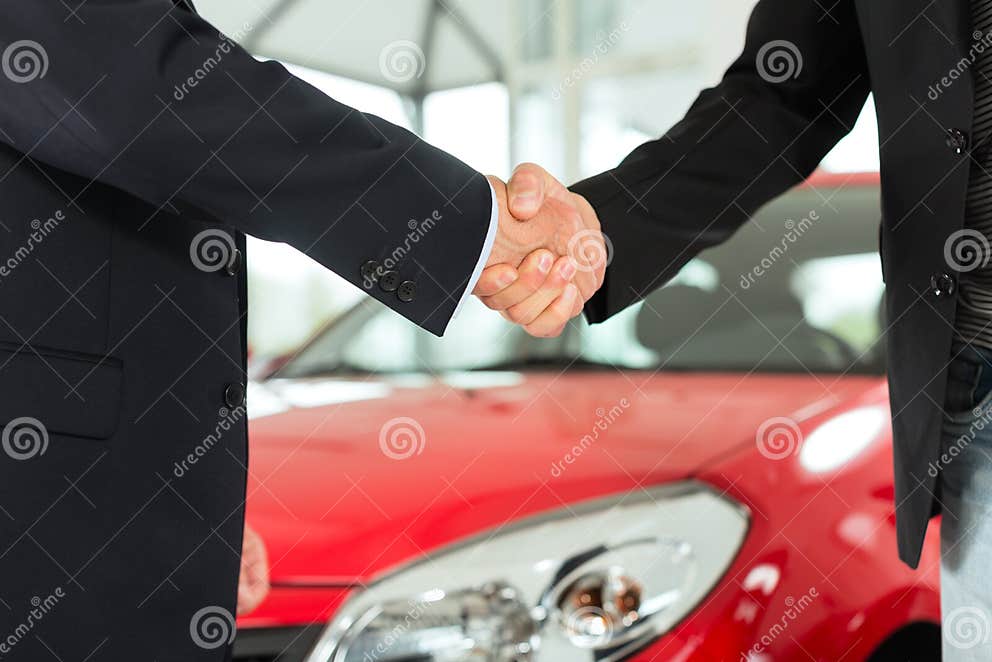 Handshake of Two Men in Suits with a Red Car Stock Image - Image of ...