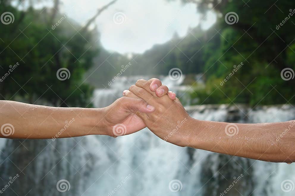 Handshake at waterfall stock image. Image of chain, hands - 11039773