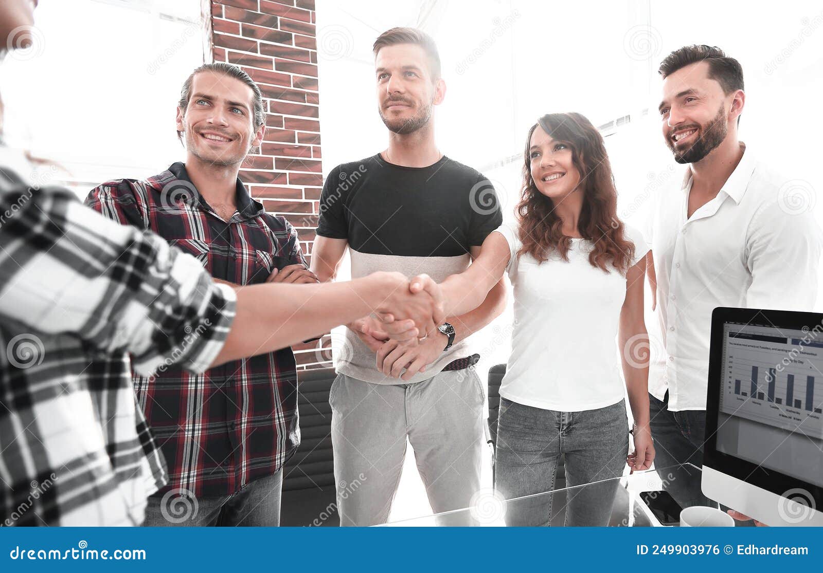 Handshake of young people stock photo. Image of design - 249903976