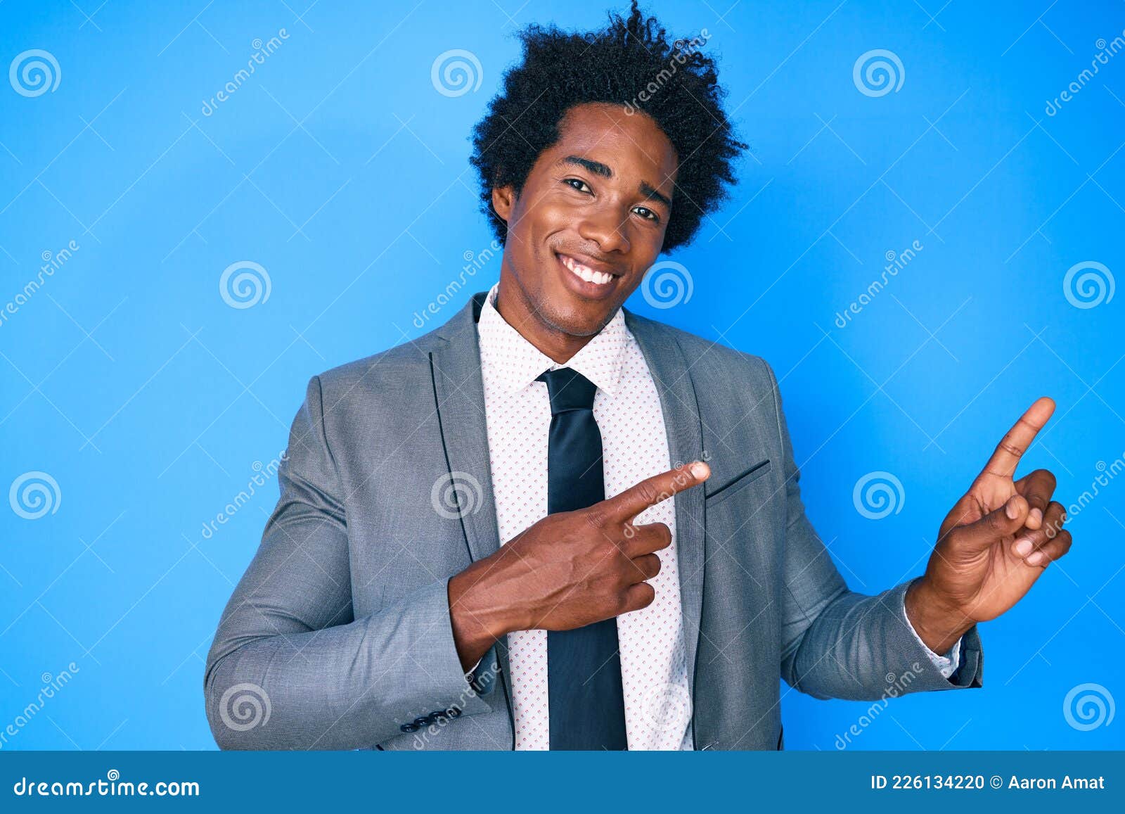 Handsome African American Man With Afro Hair Wearing Business Jacket