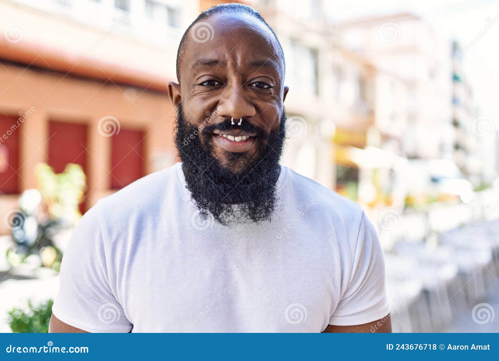 Handsome African American Man With Beard Wearing Casual White T Shirt