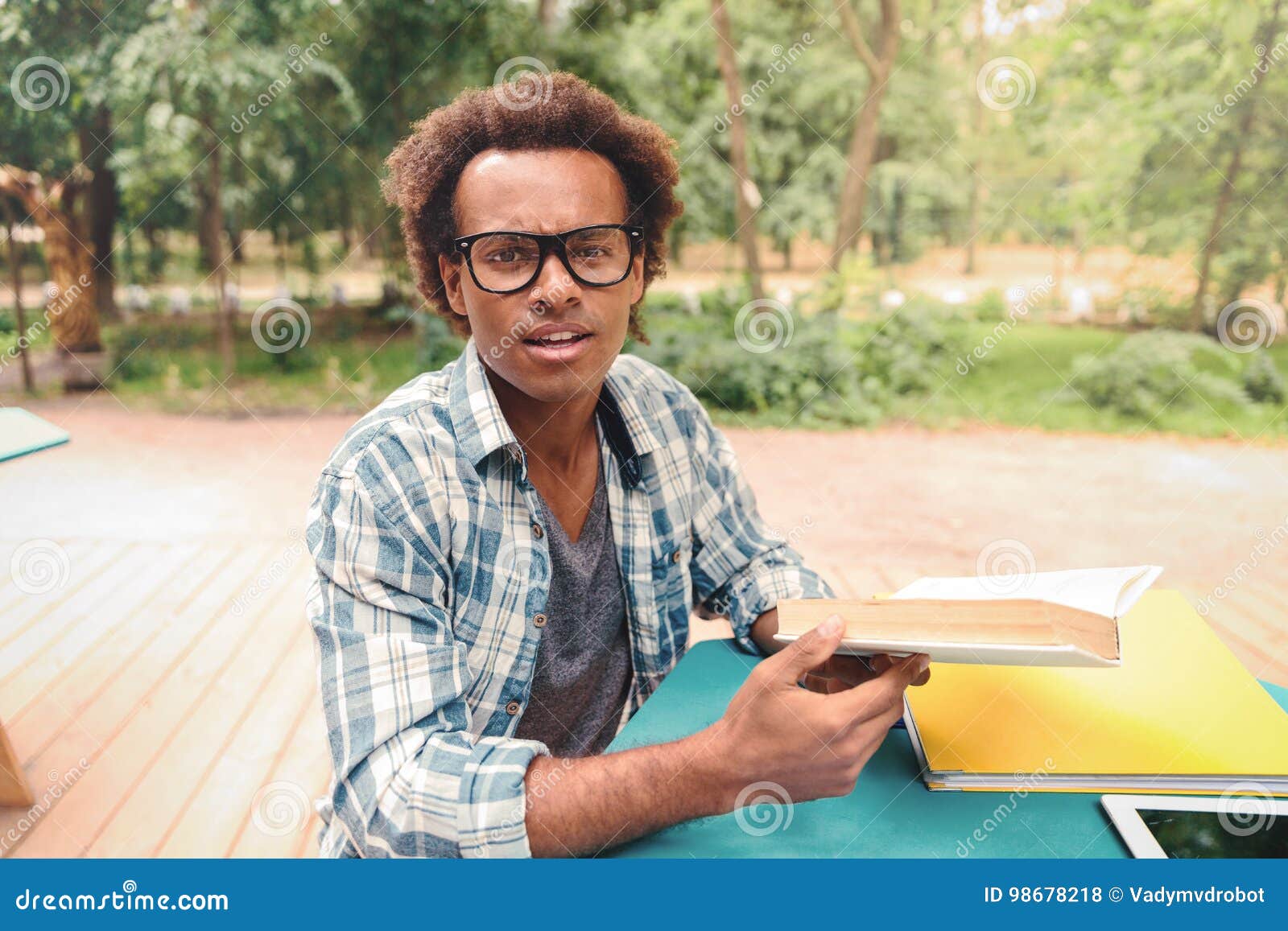 Handsome African Young Man Reading and Learning in Outdoor Cafe Stock ...