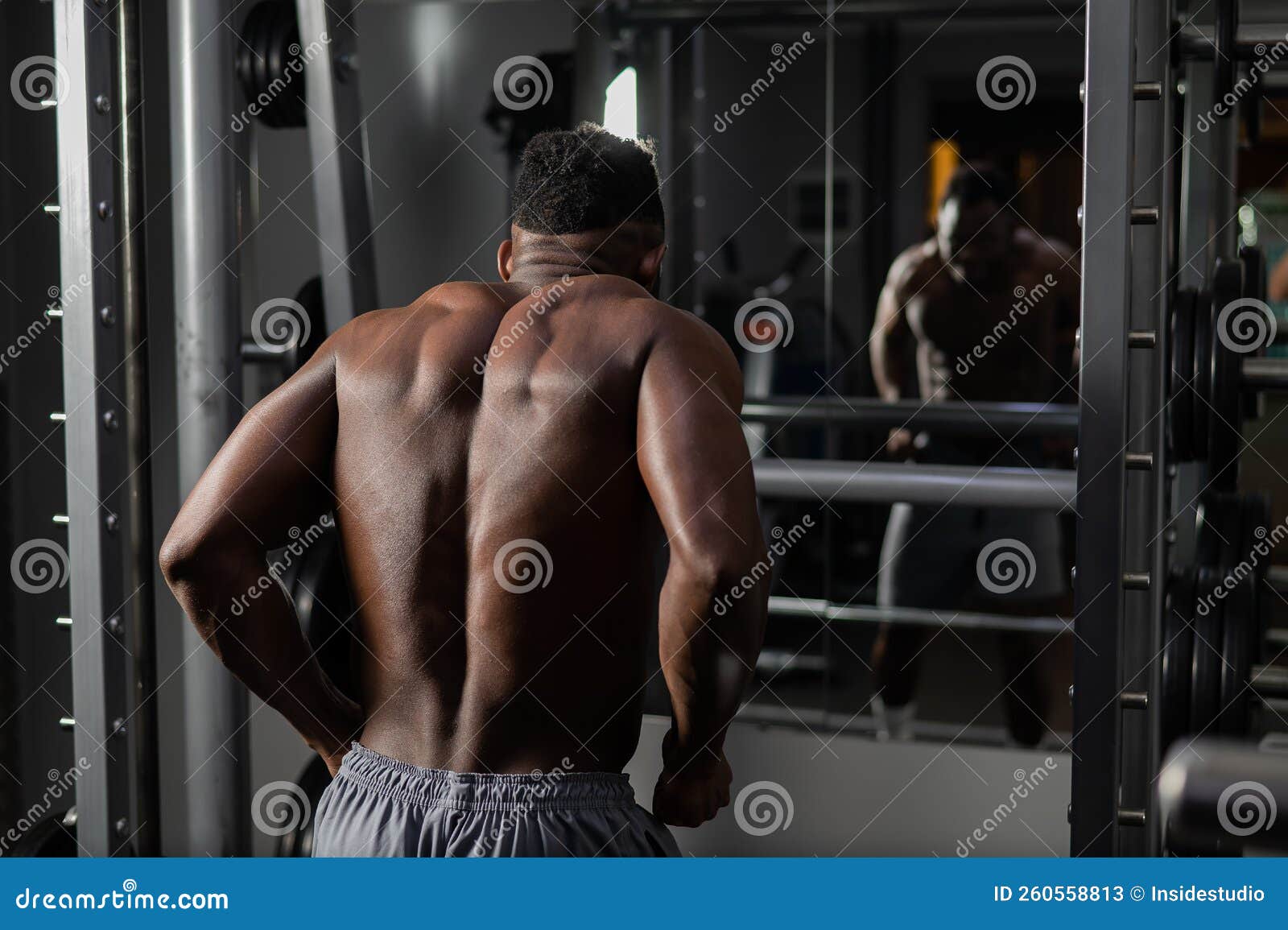 Handsome Afro American Man Posing Showing Back Muscles in Gym. Stock ...