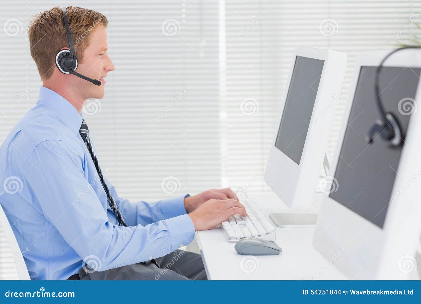 Handsome Agent with Headset Typing on Keyboard Stock Photo - Image of ...