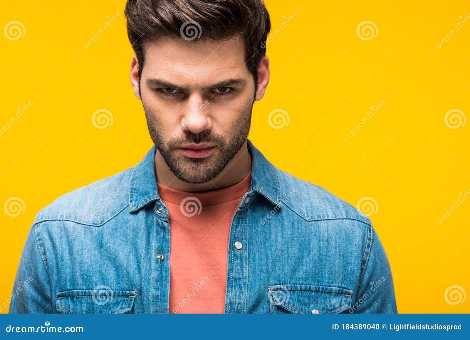 Aggressive Man Looking at Camera Isolated on Yellow Stock Photo - Image ...