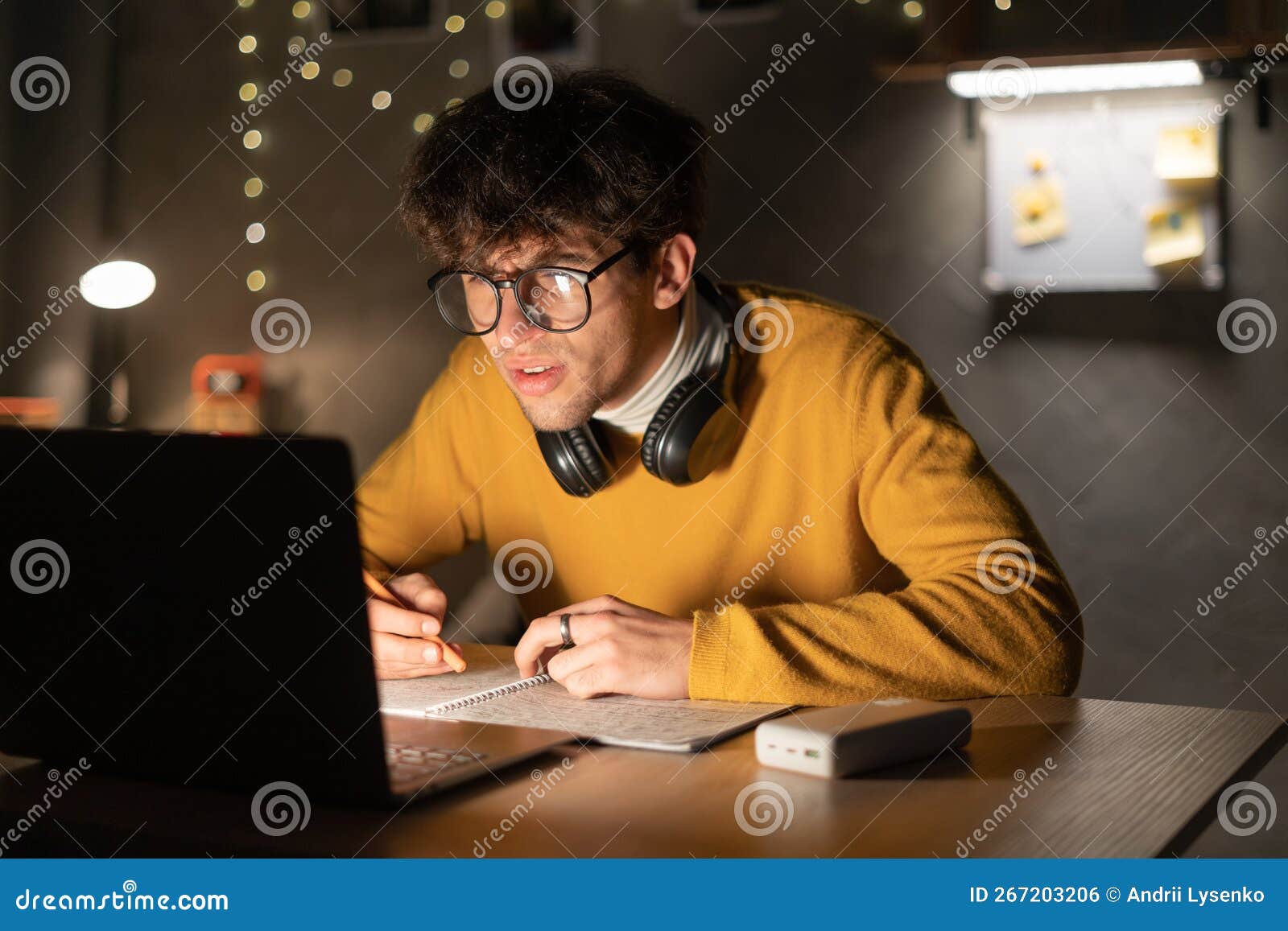 Handsome Arabic College Student Studying on Laptop Writing Notes in ...