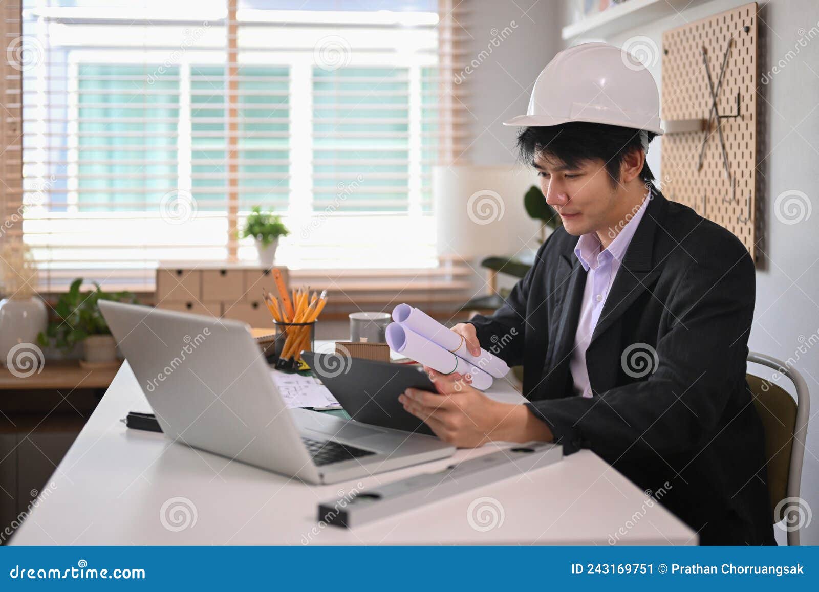 Architect Male Using Digital Tablet and Working on Architectural Plan ...
