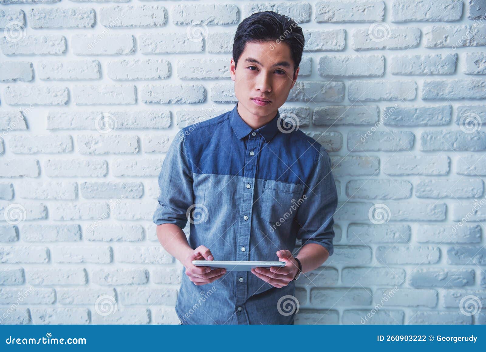 Handsome Asian Guy with Gadget Stock Photo - Image of attractive ...