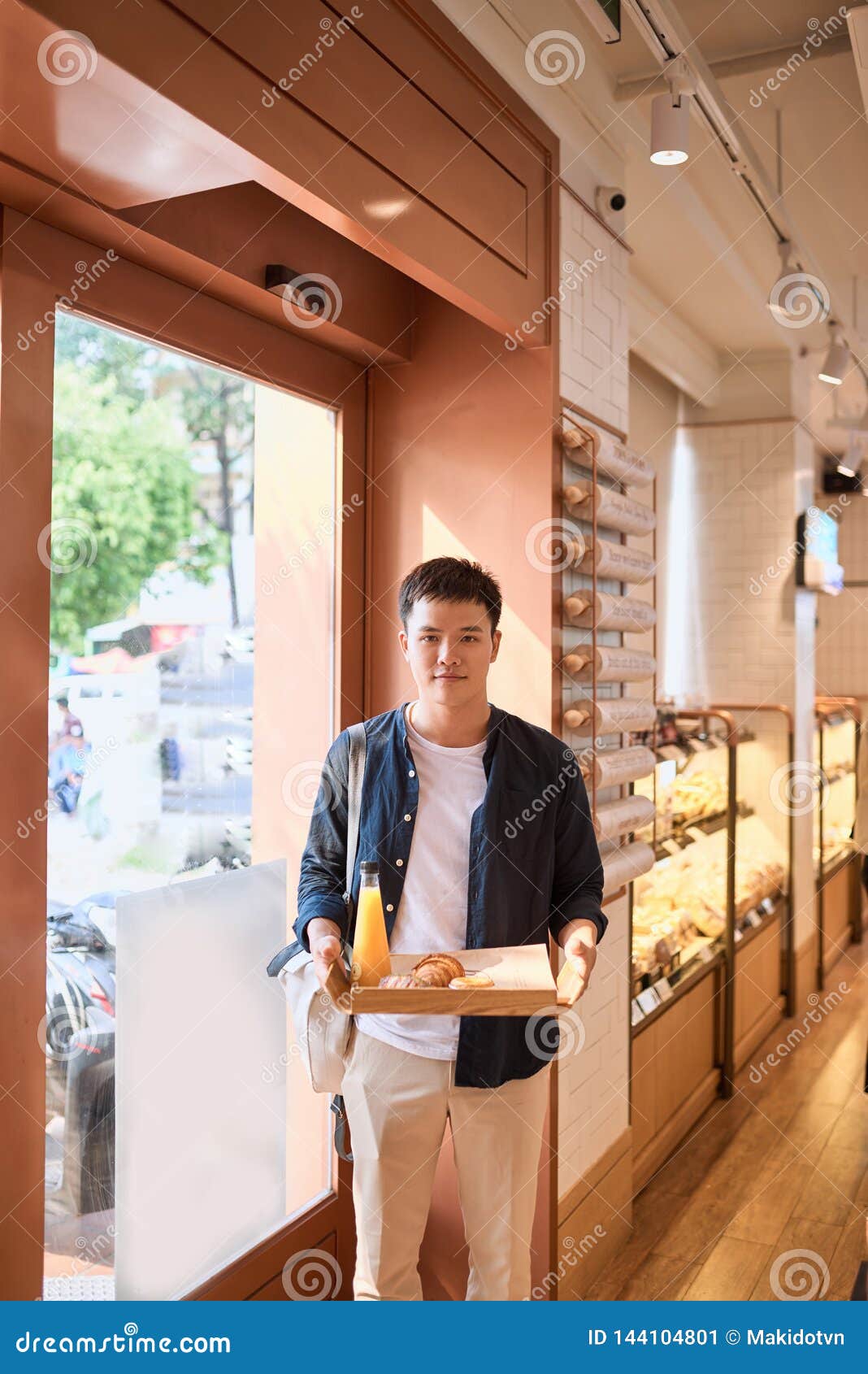 Handsome Asian Man Buying Bakery for Coffee Break in the Afternoon ...