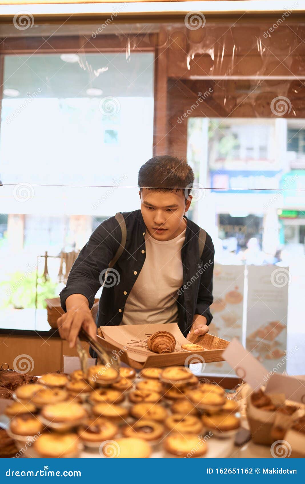 Handsome Asian Man Choosing Bakery in Store Stock Photo - Image of ...