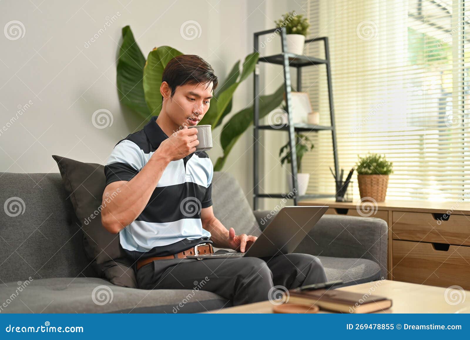 Handsome Asian Man Looking at Screen, Watching Video or Surfing ...