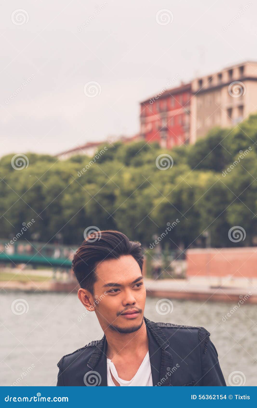 Handsome Asian Model Posing by an Artificial Basin Stock Photo - Image ...