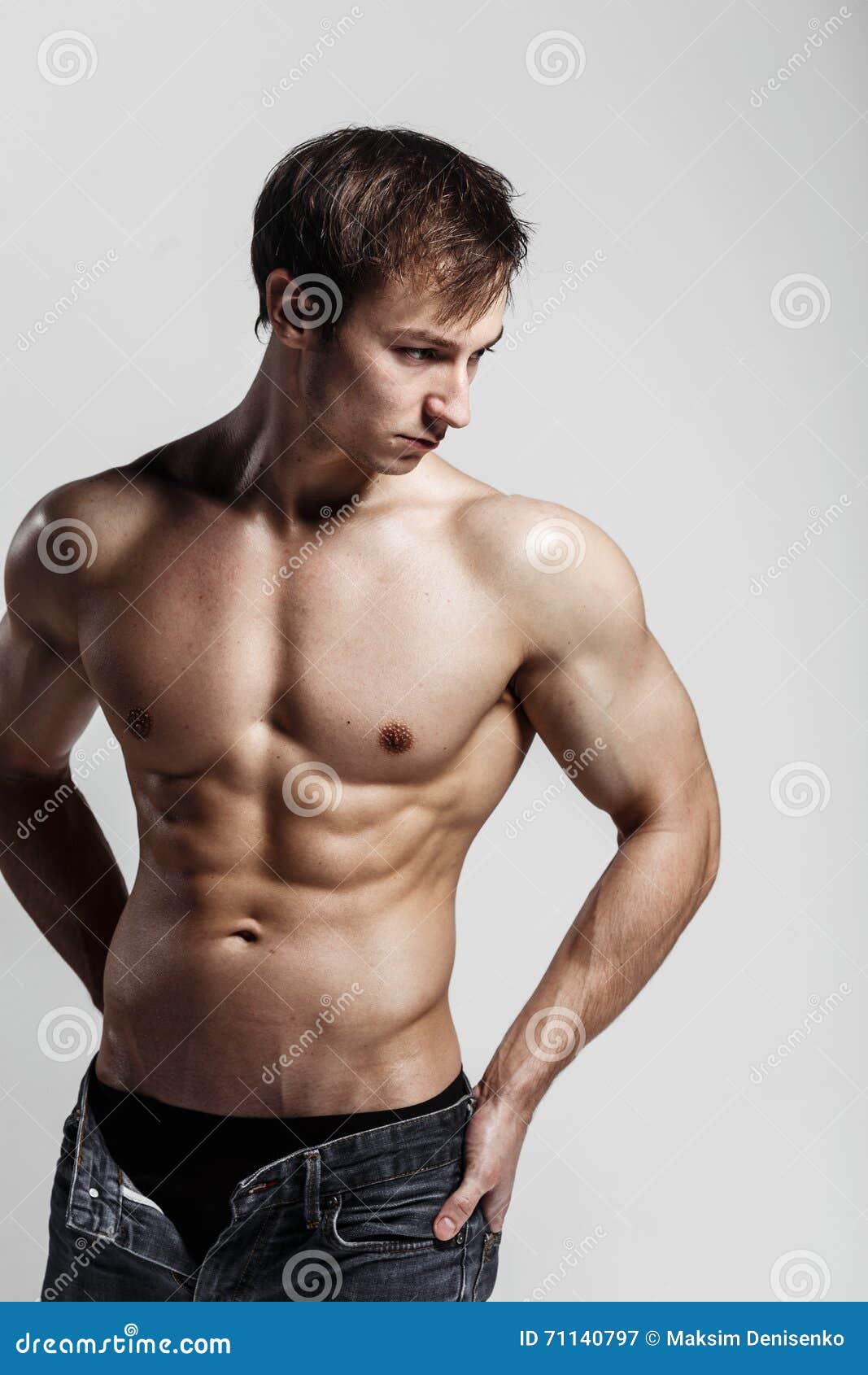 Handsome Athletic Man Looking at Side in Unbuttoned Jeans. Strong ...